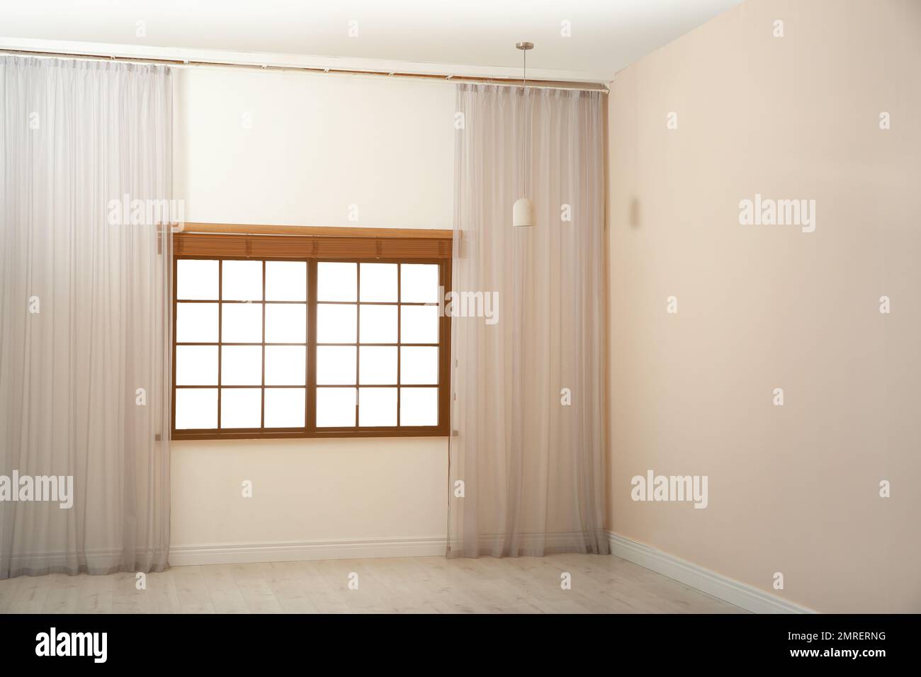 Window with beautiful curtains and open blinds in empty room Stock ...