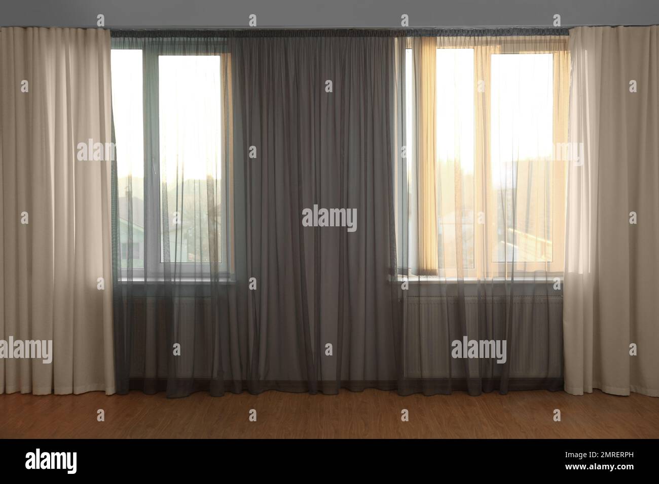 Windows with beautiful curtains in empty room Stock Photo - Alamy