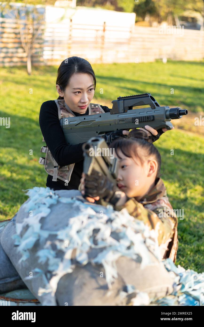 Happy mother and daughter playing cs Stock Photo - Alamy