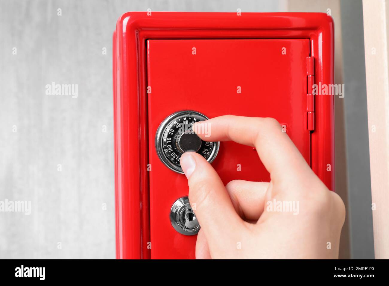 Man opening steel safe with mechanical combination lock, closeup Stock ...