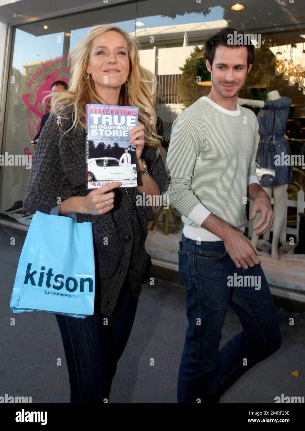 "Dexter" actress Julie Benz shows off a copye of Perez Hilton's "True ...