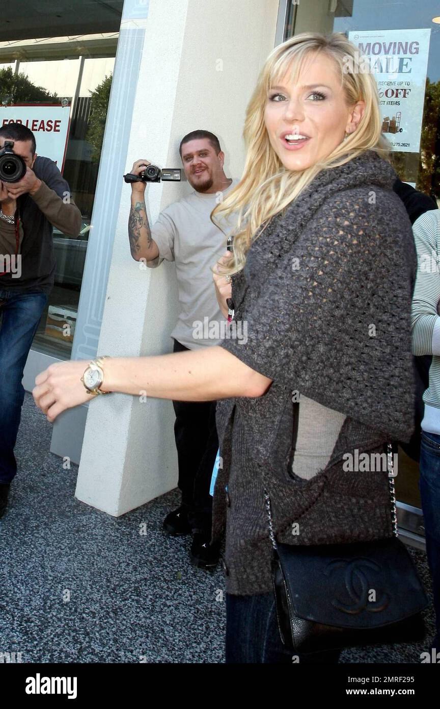 "Dexter" actress Julie Benz shows off a copye of Perez Hilton's "True ...