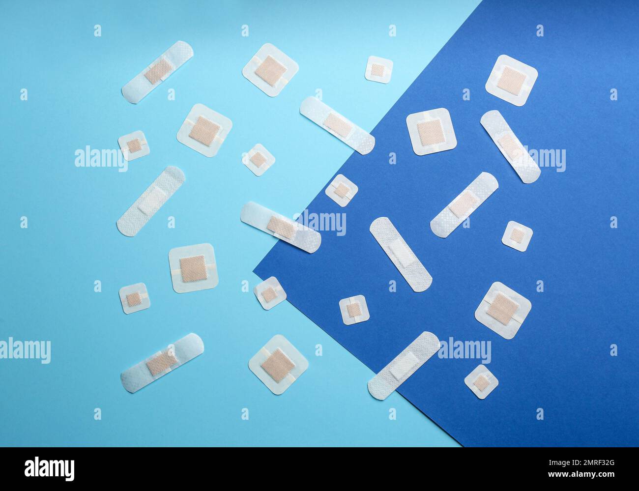 Different types of sticking plasters on blue background, flat lay Stock ...