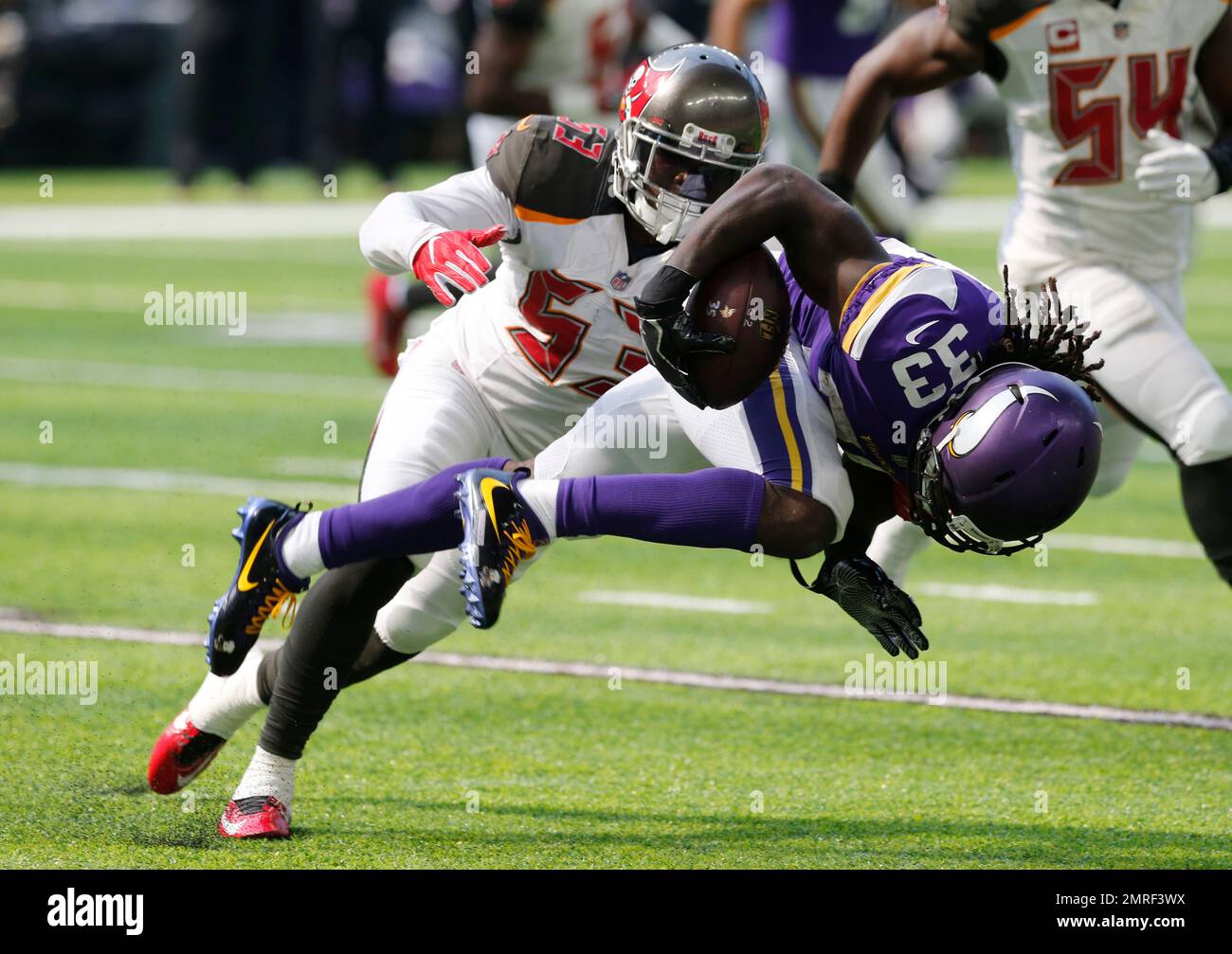Minnesota Vikings running back Dalvin Cook (33) is tackled by Tampa Bay ...