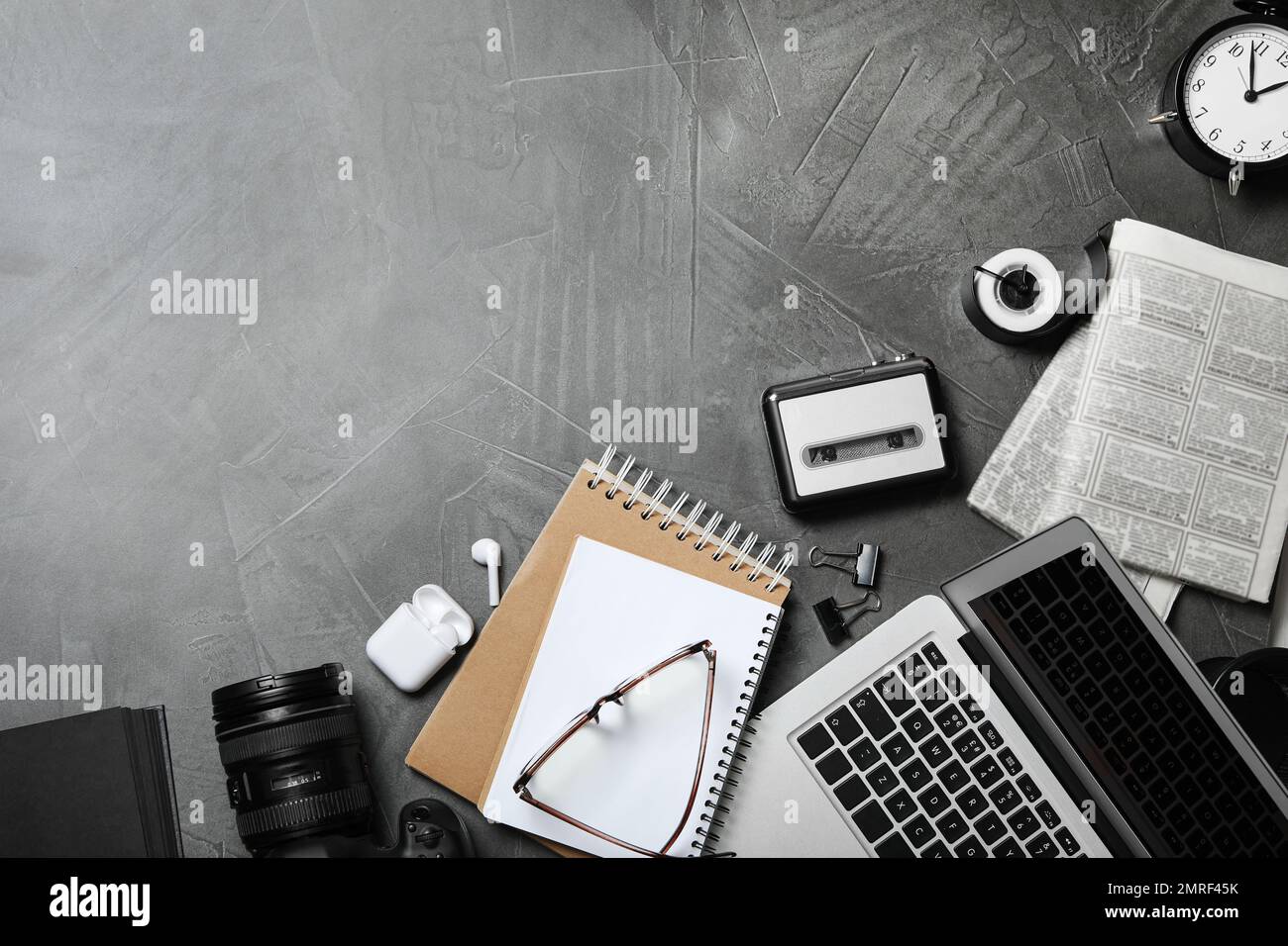 Flat lay composition with equipment for journalist on grey table, space ...