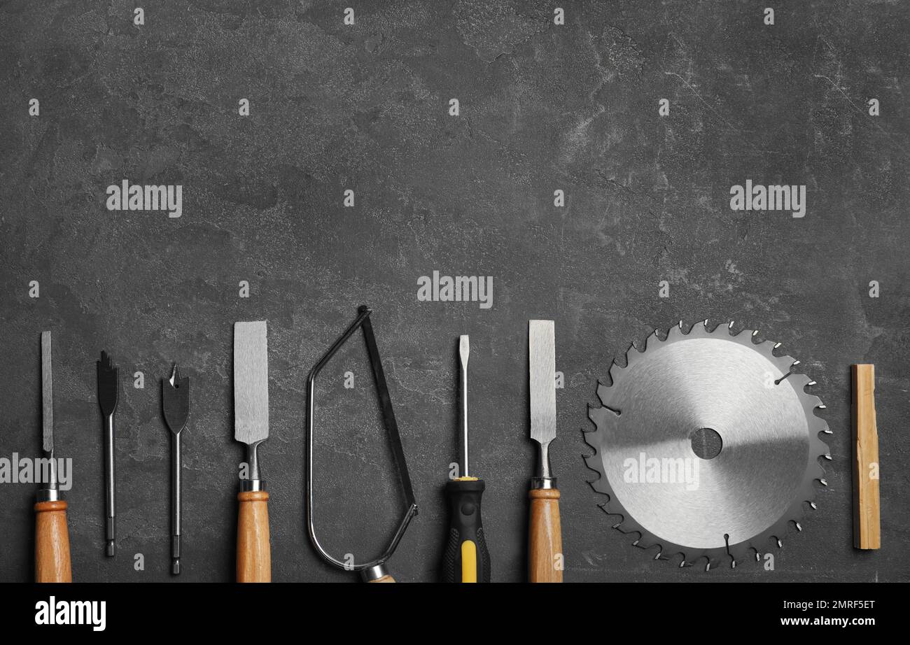 Flat lay composition with carpenter's tools on grey background. Space ...