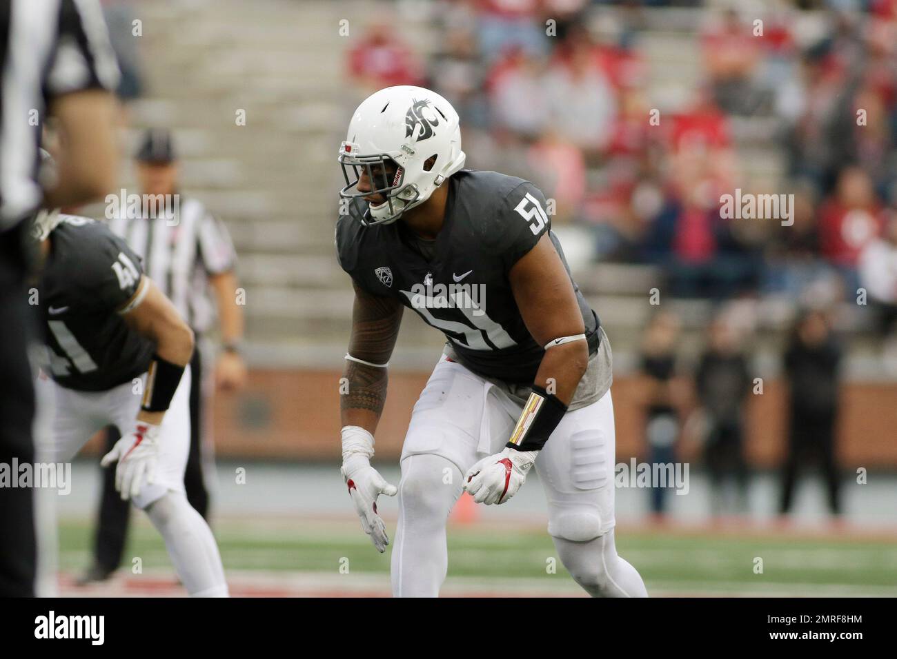 Washington State linebacker Frankie Luvu (51) lines up for a play ...