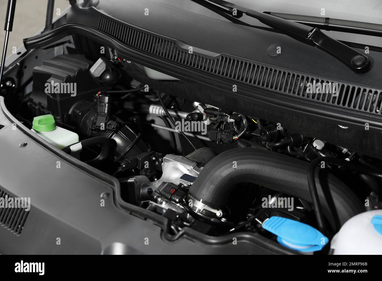 Closeup view of engine bay in modern car Stock Photo - Alamy