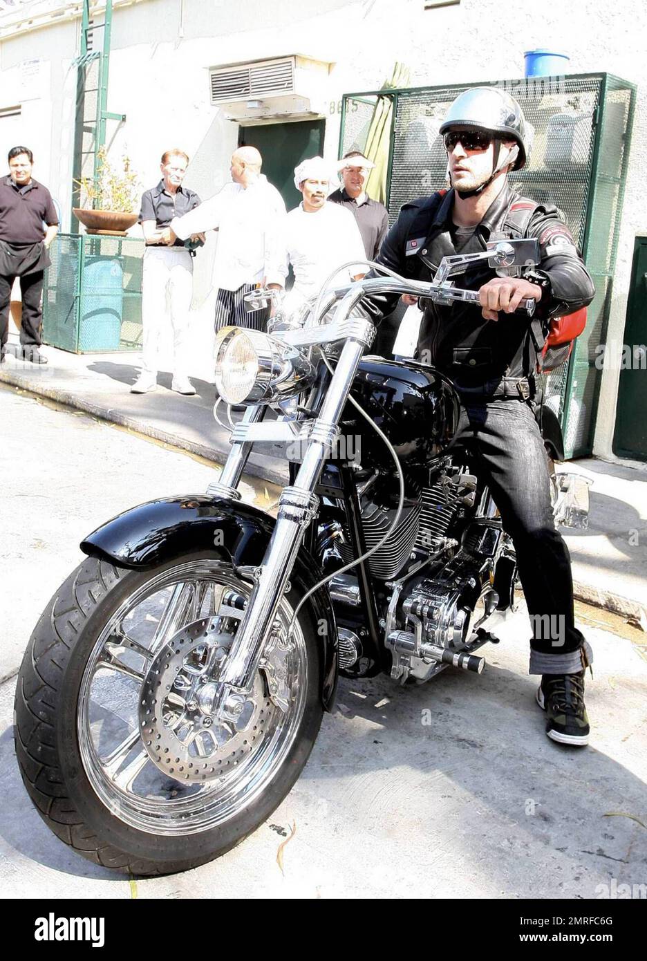 Biker dude Justin Timberlake hops on his big black motorcycle and heads ...