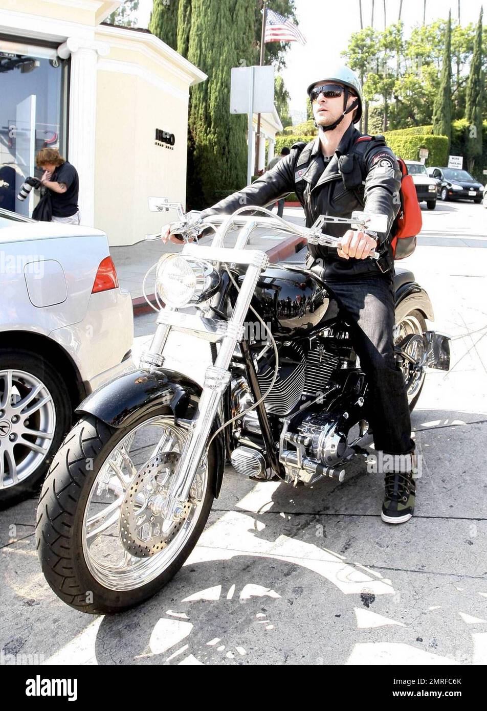 Biker dude Justin Timberlake hops on his big black motorcycle and heads off after lunching at ...