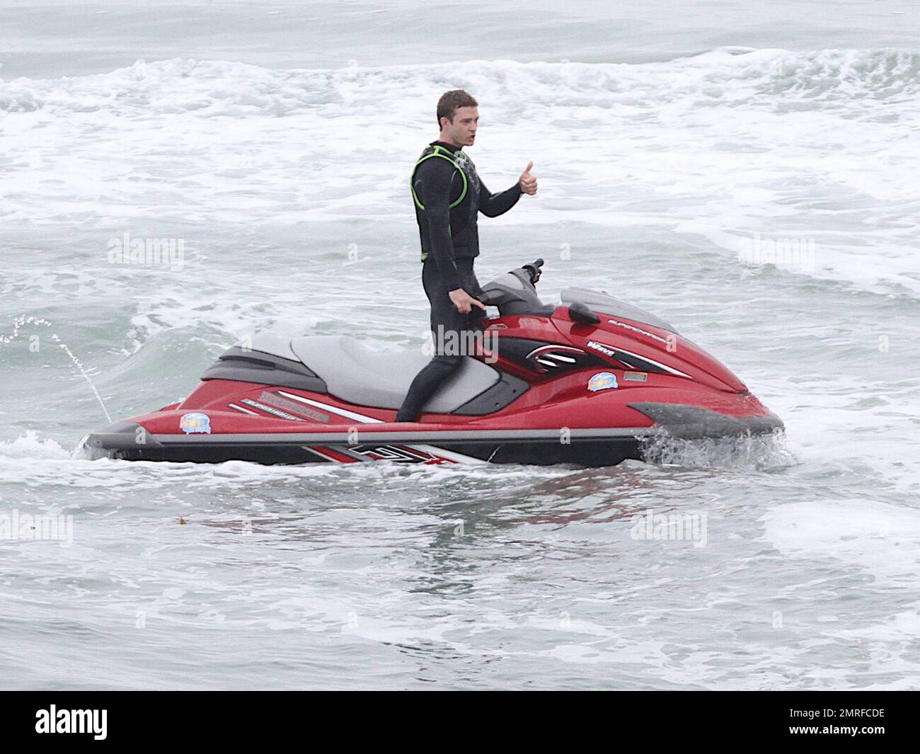 Justin Timberlake speeds around the ocean on a jet-ski while filming a ...