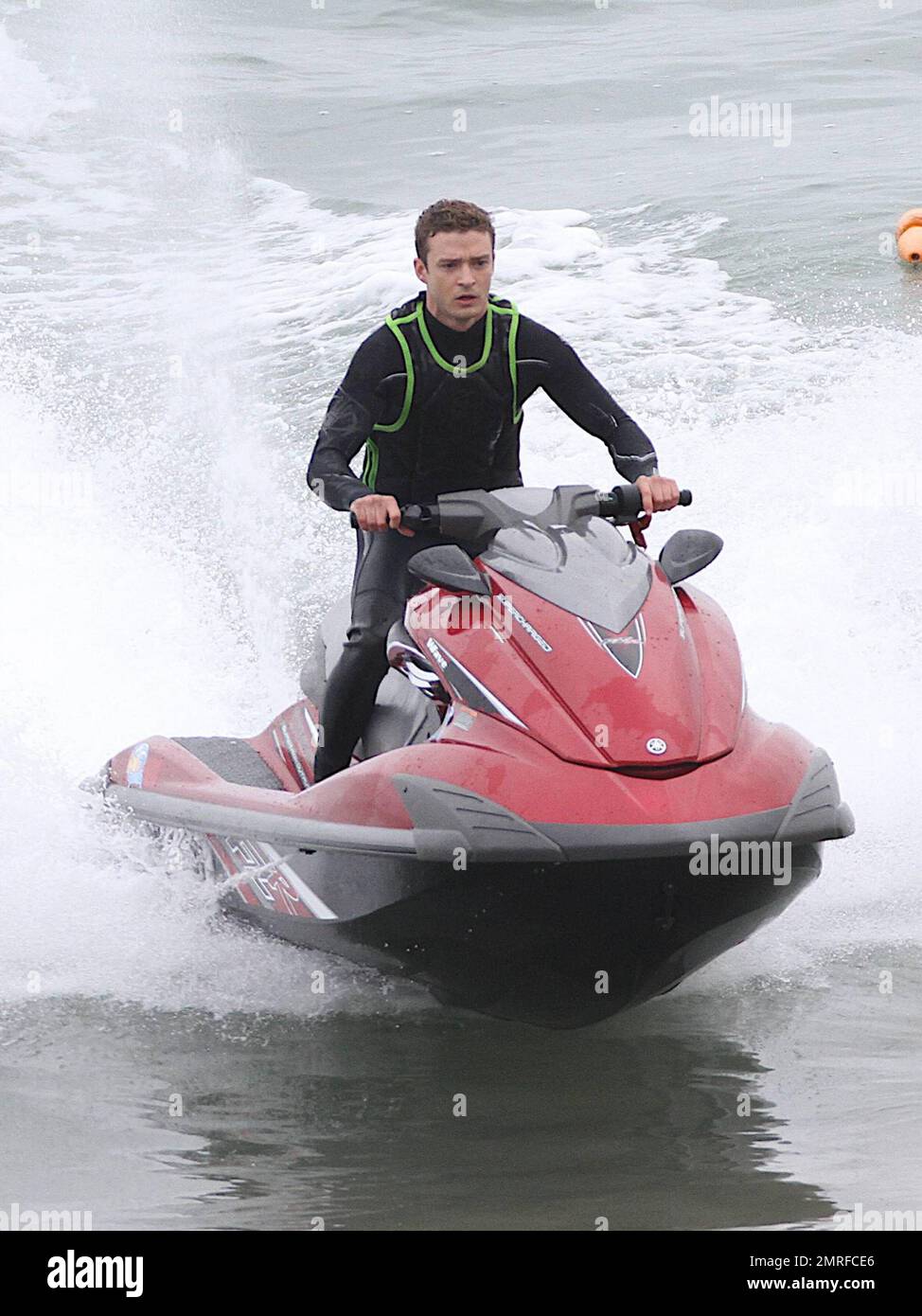 Justin Timberlake speeds around the ocean on a jet-ski while filming a ...