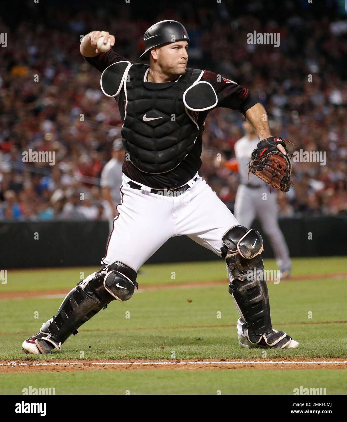 Arizona Diamondbacks catcher Chris Iannetta throws to first against the ...