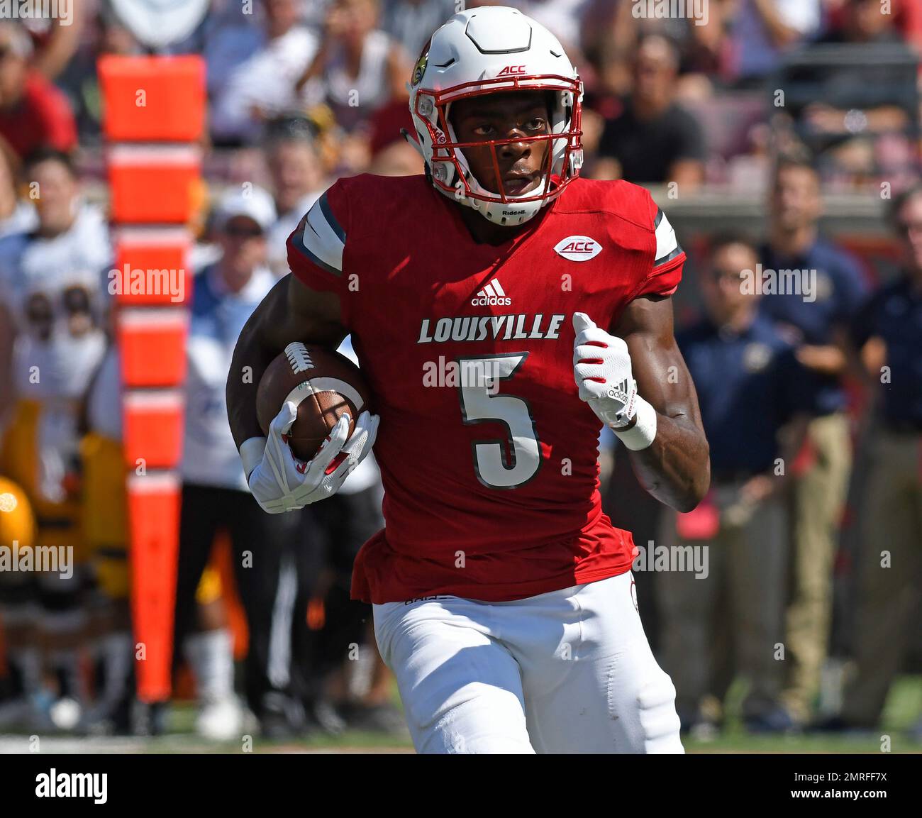 Louisville wide receiver Seth Dawkins (5) attempts to gain yardage ...