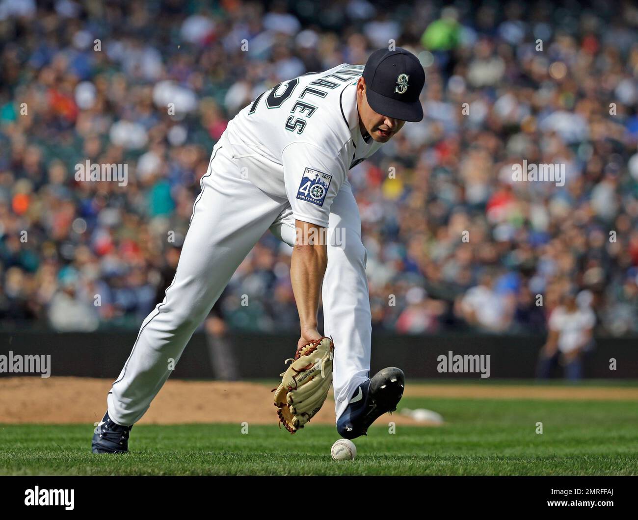Seattle Mariners relief pitcher Marco Gonzales chases an infield ...