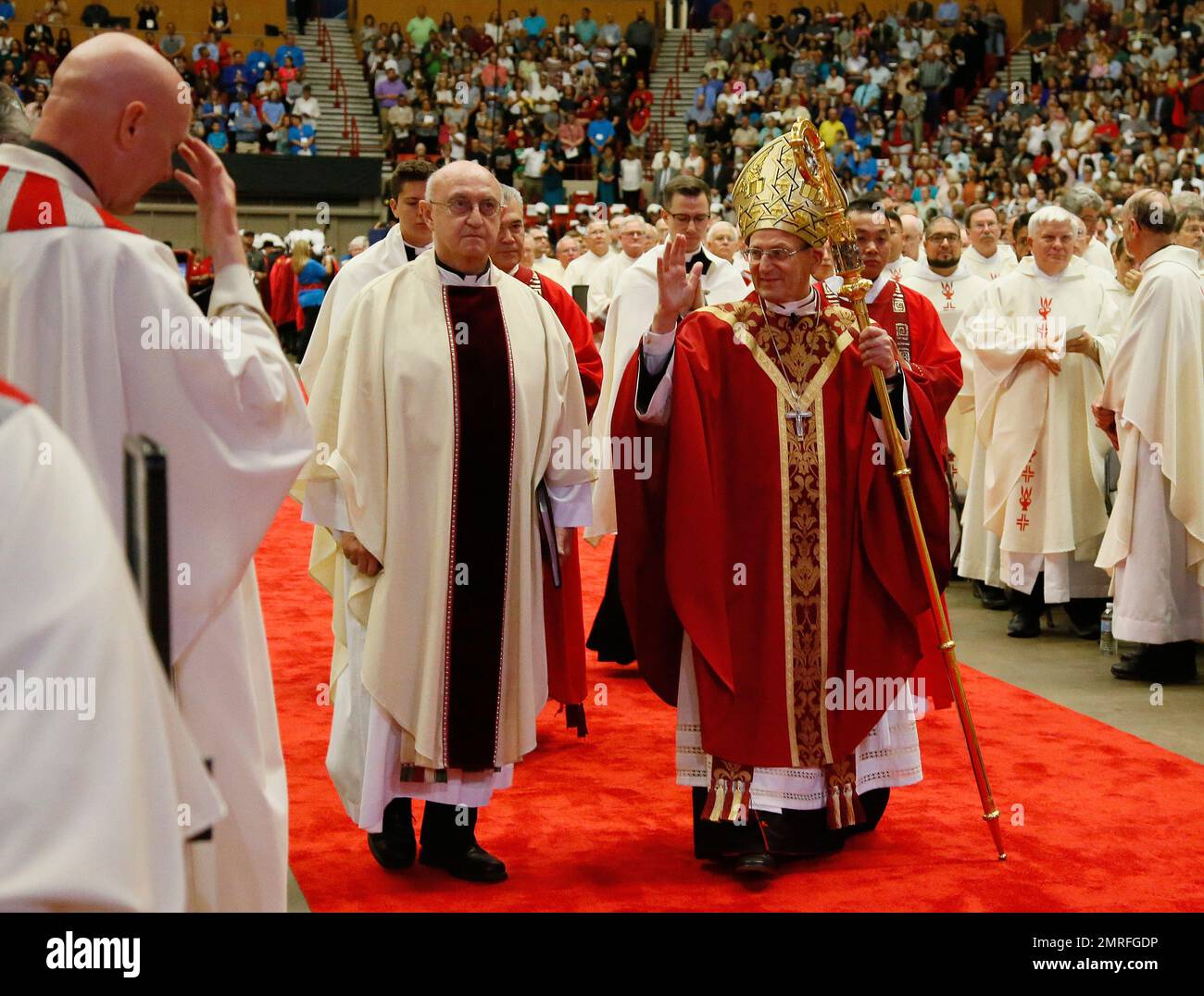 Cardinal Angelo Amato, right, gives blessings as he walks in the ...