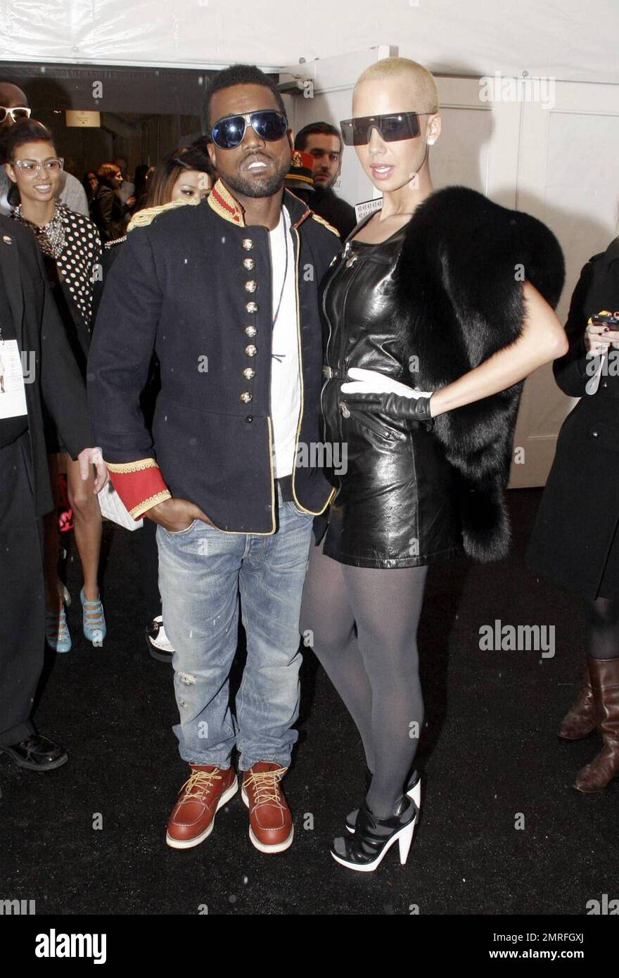 Singer Amber Rose and rapper Kanye West attend the Alexander ...