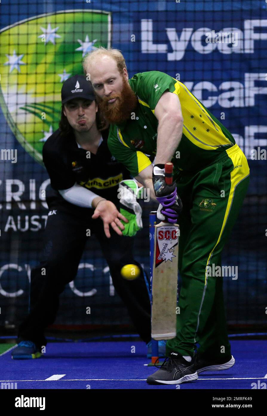 Australia's Timothy Flores plays a shot against New Zealand during the ...
