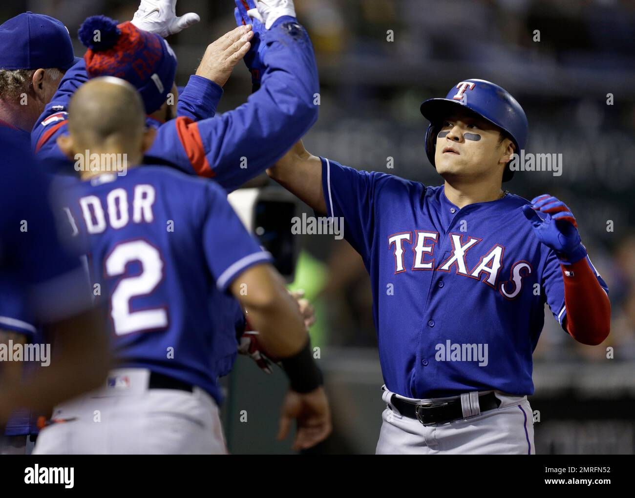 Texas Rangers' Shin-Soo Choo, right, celebrates after hitting a home ...