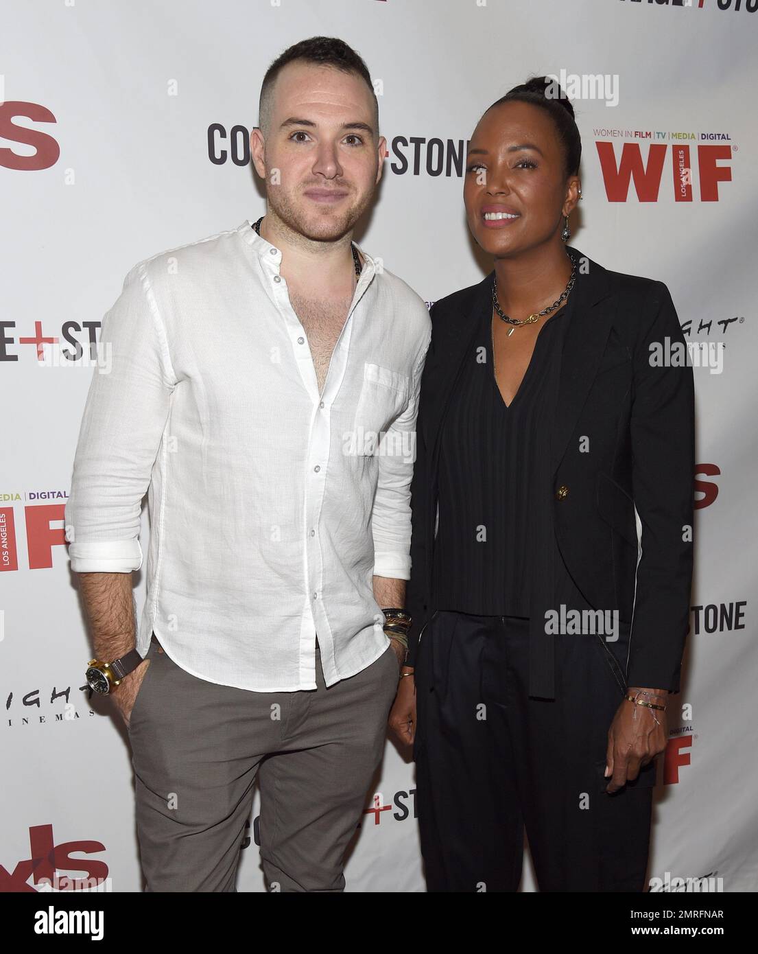 Emmett Hughes, left, and Aisha Tyler attend a panel discussion for "Axis" at ArcLight Hollywood ...