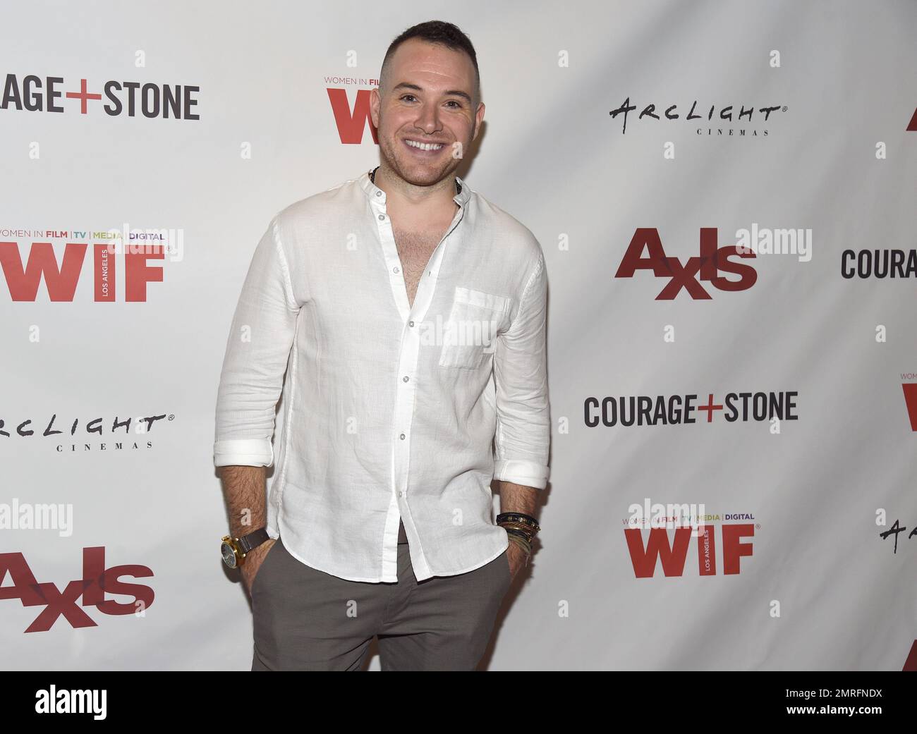 Emmett Hughes attends a panel discussion for "Axis" at ArcLight ...