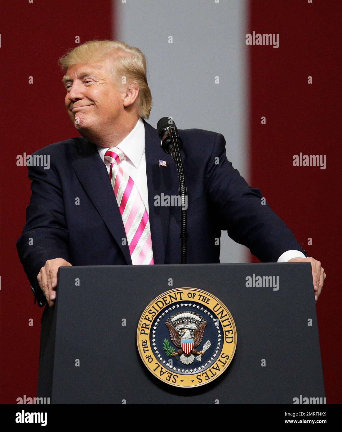 President Donald Trump smiles at the crowd as he speaks at campaign ...