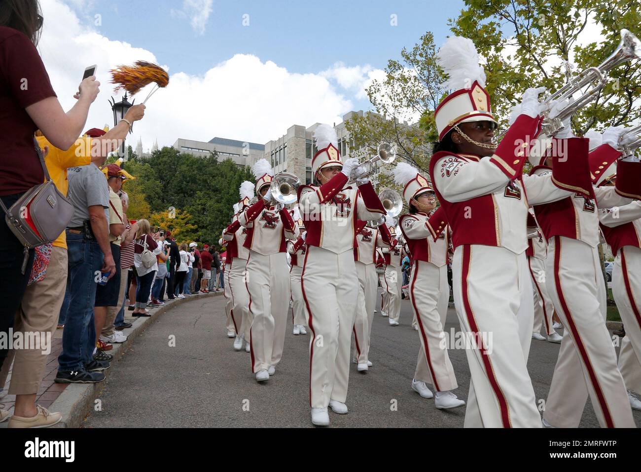 The Boston College marching band walks through the campus during the ...