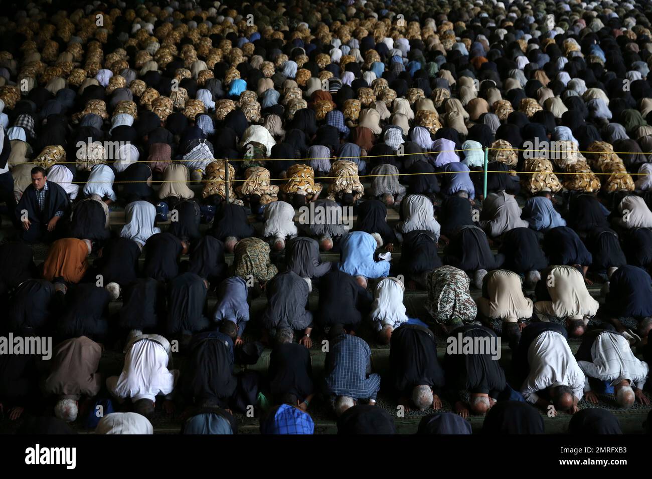 Iranian worshippers pray at the Tehran University campus in Tehran ...