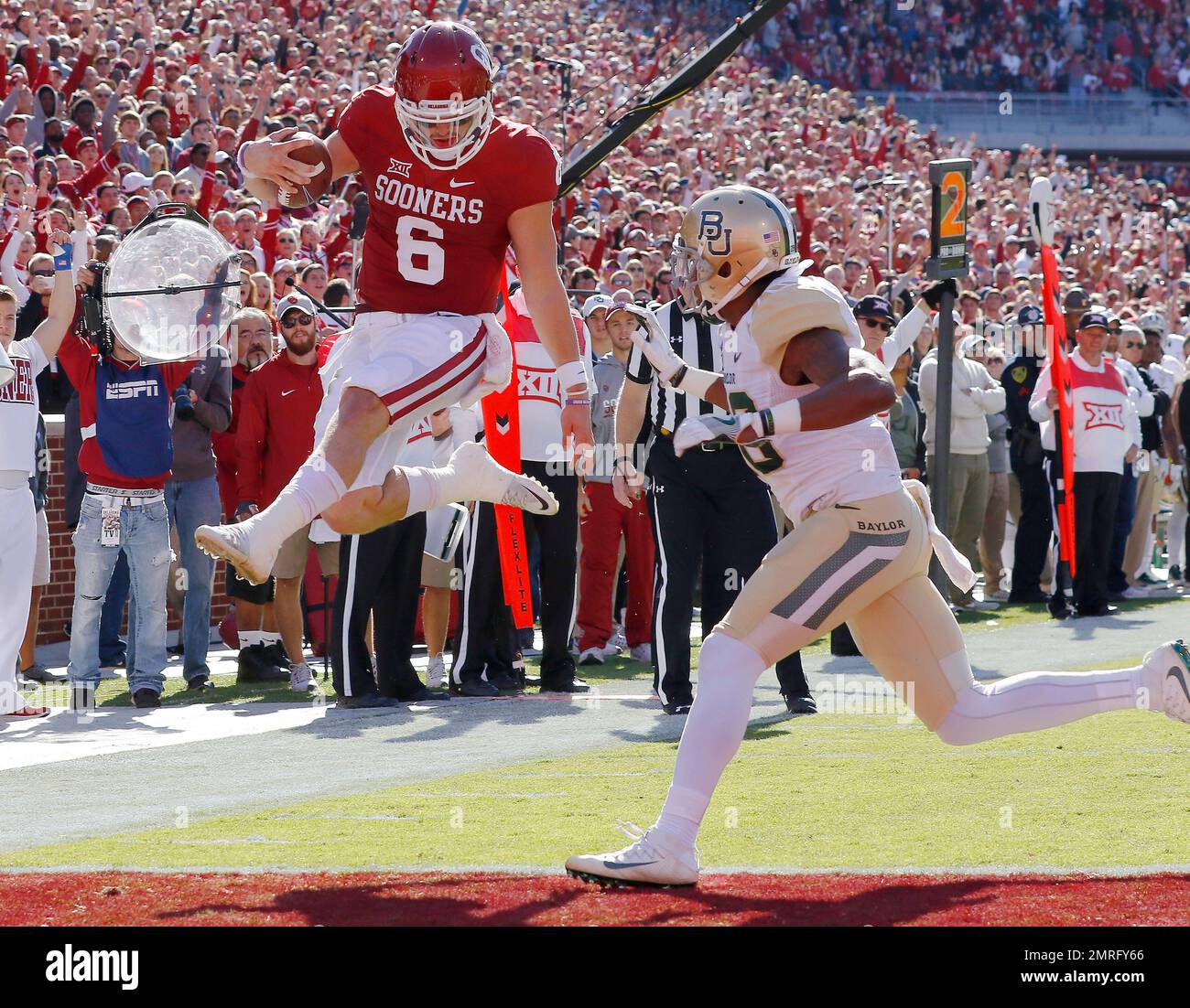 FILE - In this Nov. 12, 2016, file photo, Oklahoma quarterback Baker Mayfield (6) runs in for a ...