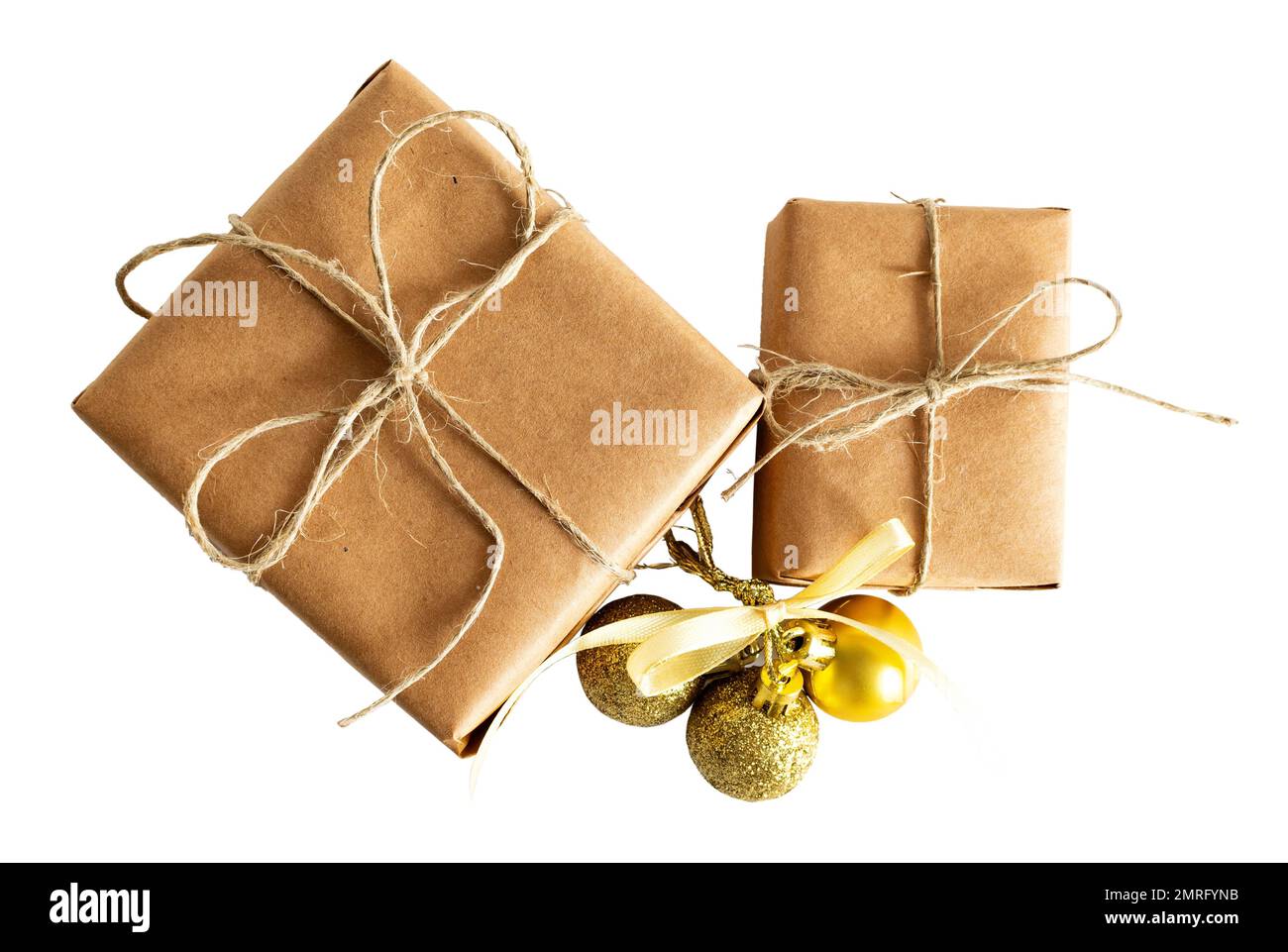 Two wrapped in rustic paper gift boxes with Christmas baubles on white ...