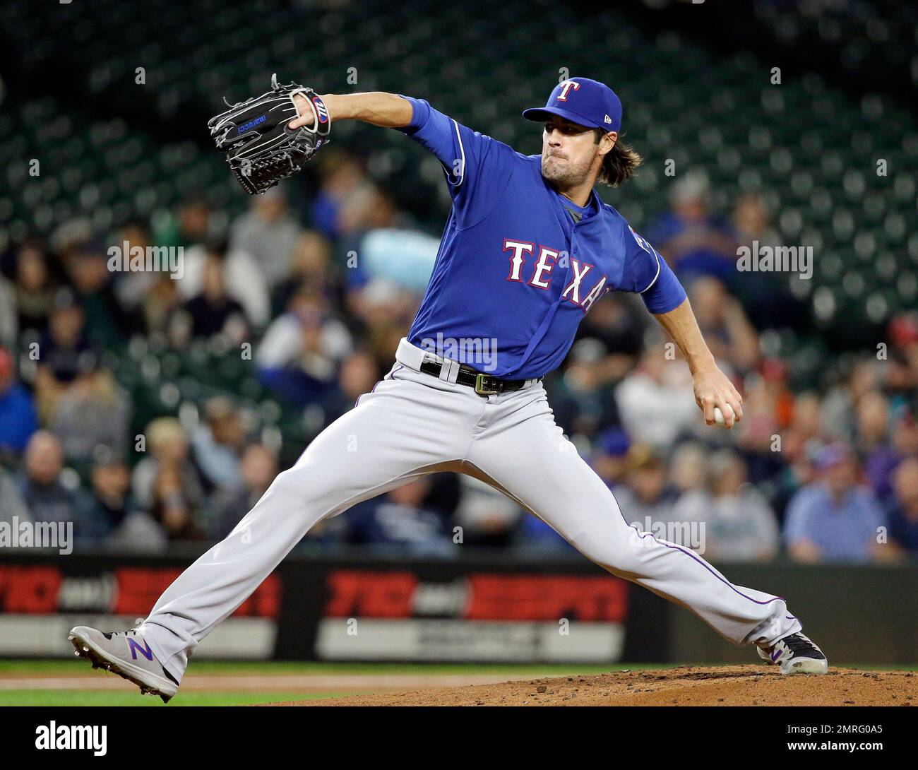 Texas Rangers Starting Pitcher Cole Hamels Throws To The Seattle