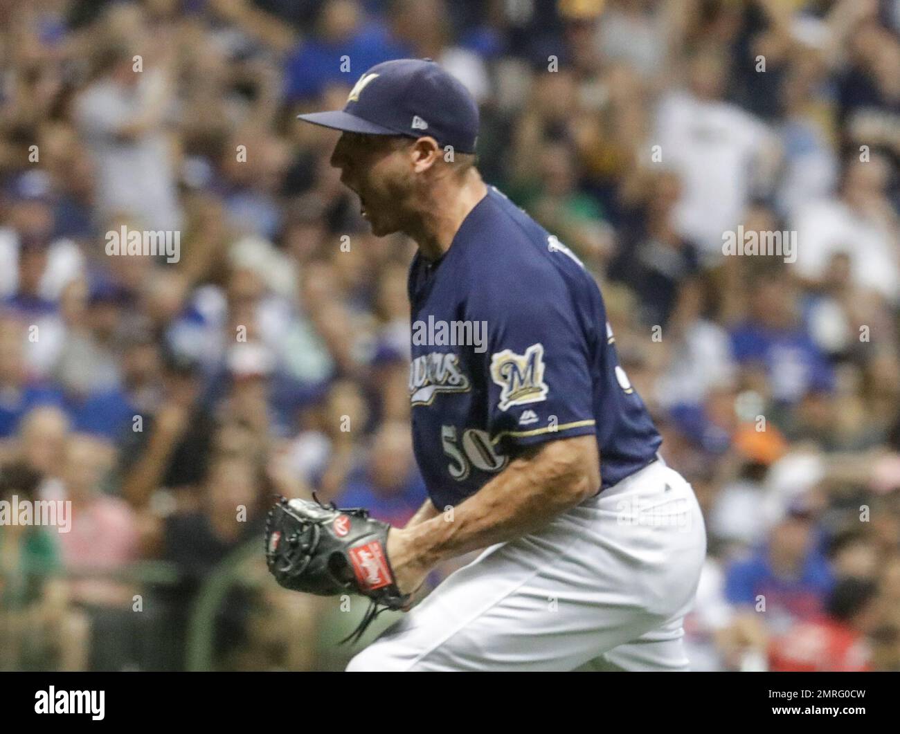 Milwaukee Brewers relief pitcher Jacob Barnes reacts after getting ...