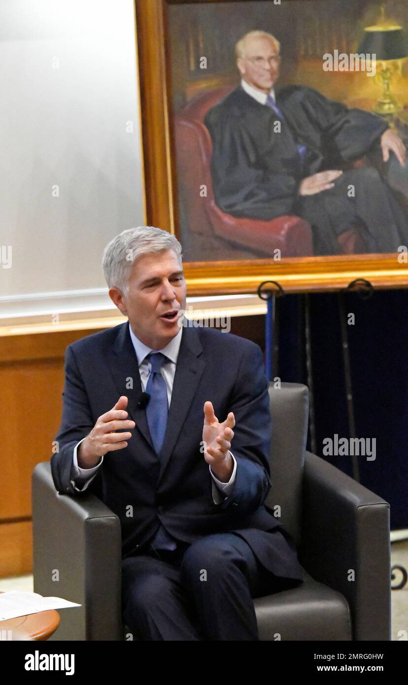 Justice Neil Gorsuch sits in front of a portrait of John G. Heyburn II ...