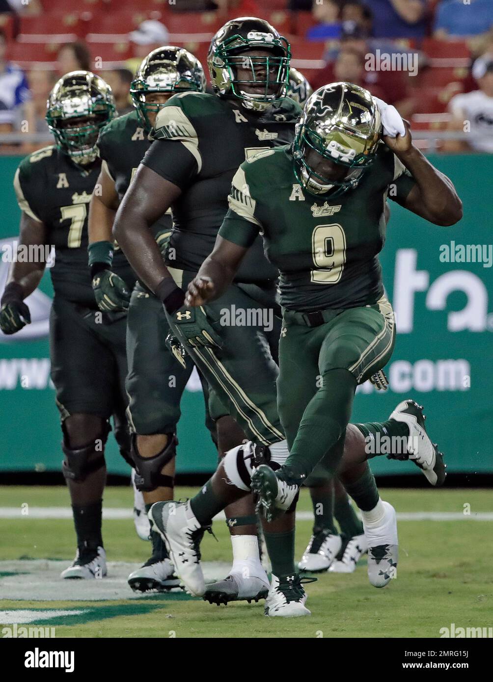 South Florida quarterback Quinton Flowers (9) celebrates after scoring ...