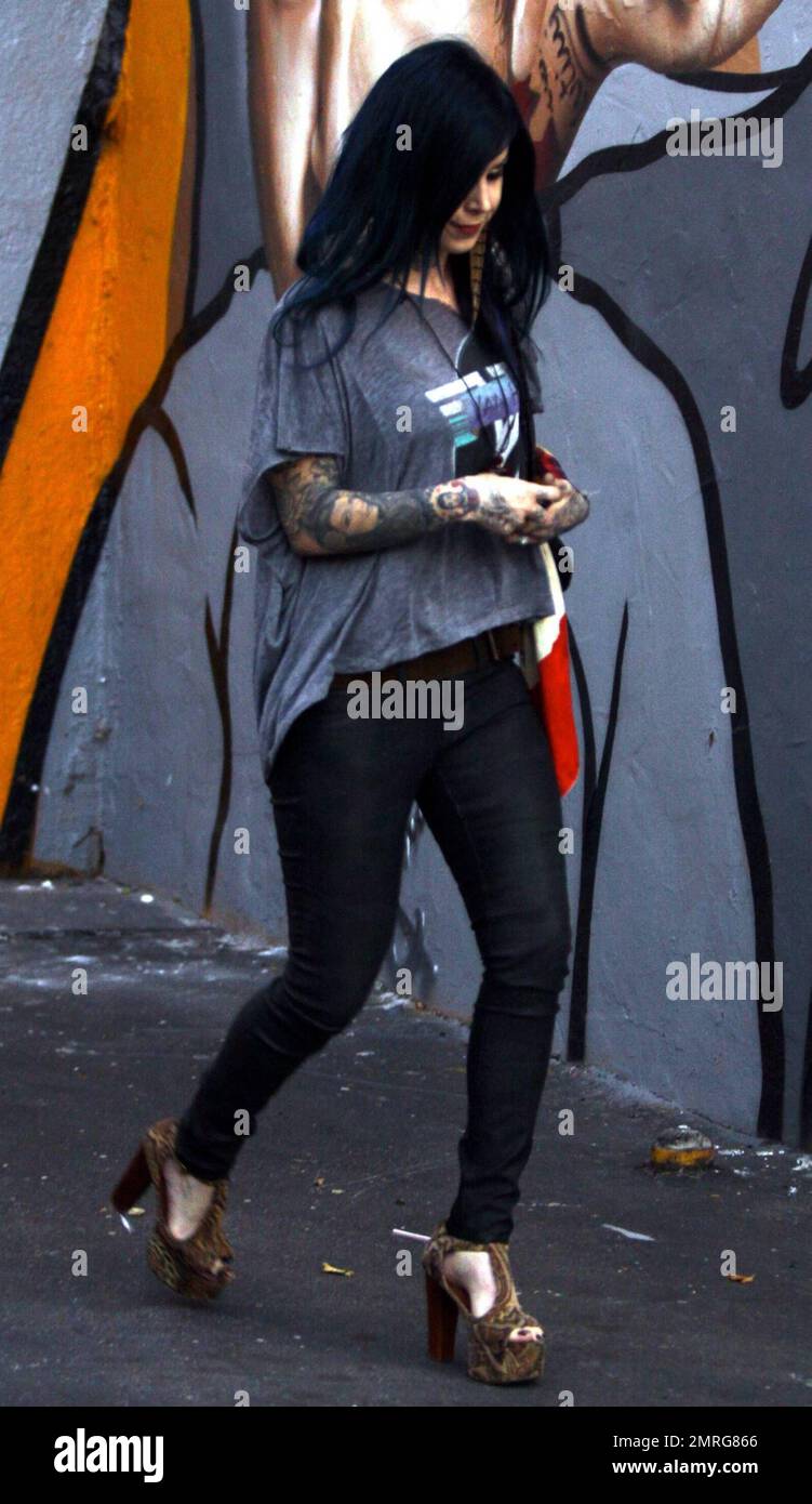 The newly engaged Kat Von D looks slim in a grey top and form-fitting ...
