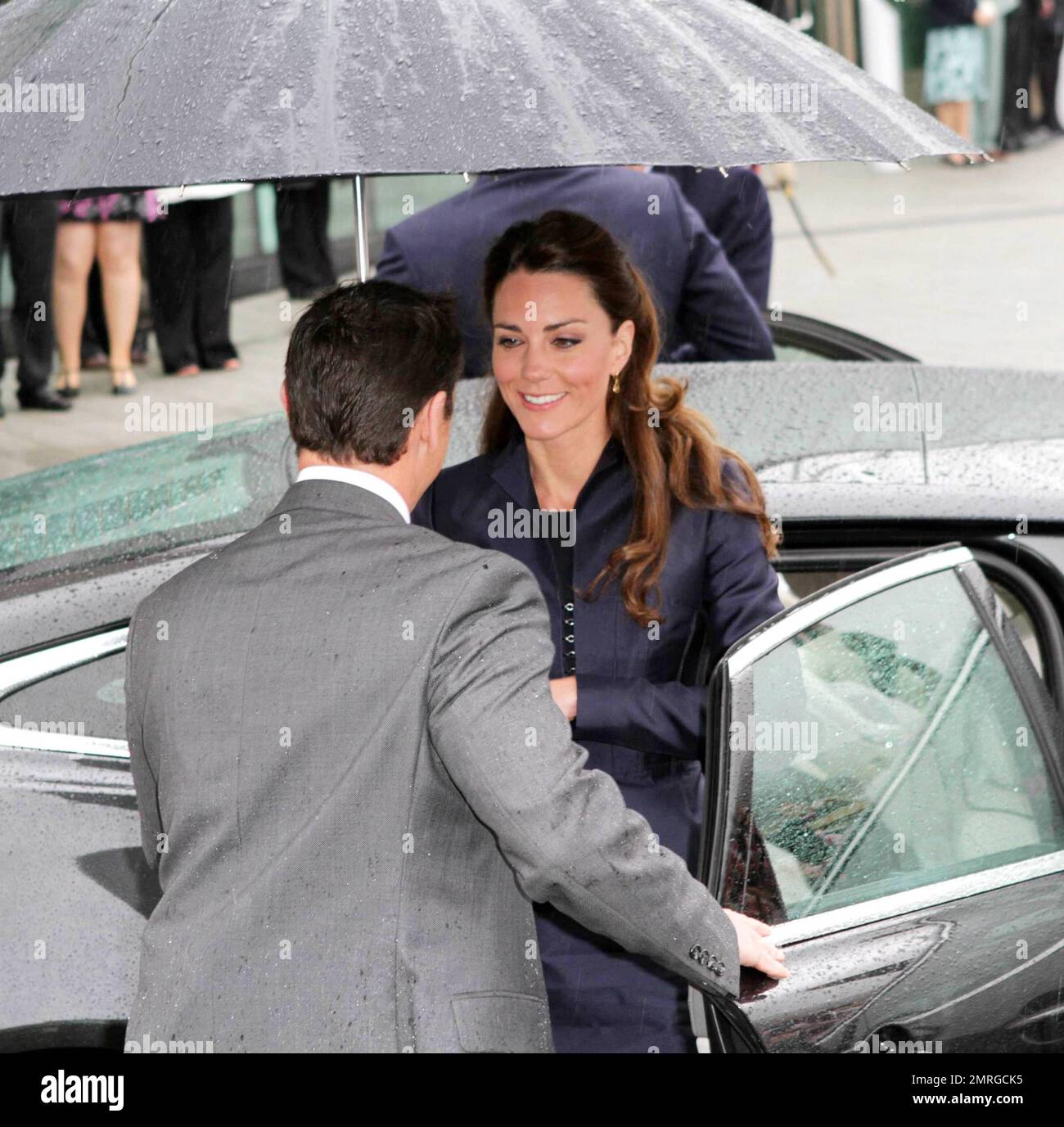 Kate Middleton, who will wed Prince William later this month, arrives in the rain to officially ...