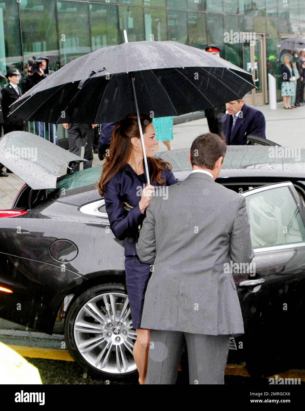 Kate Middleton, who will wed Prince William later this month, arrives in the rain to officially ...