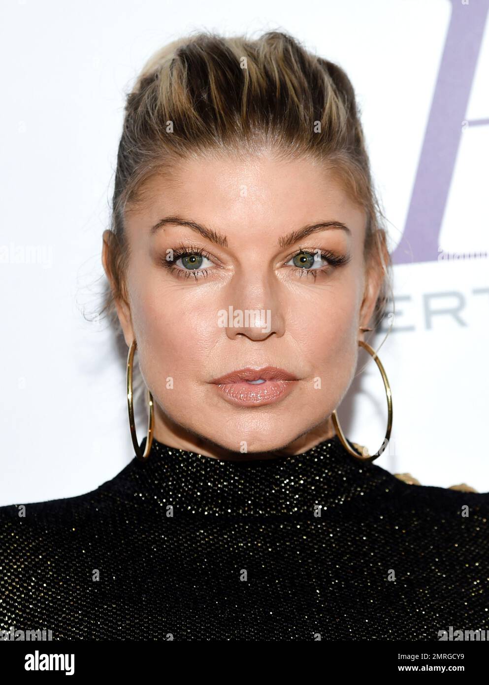 Singer Fergie arrives at a premiere screening of her new visual album ...