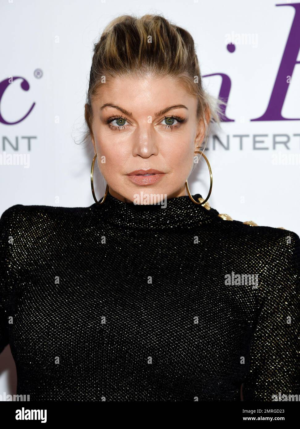 Singer Fergie arrives at a premiere screening of her new visual album ...