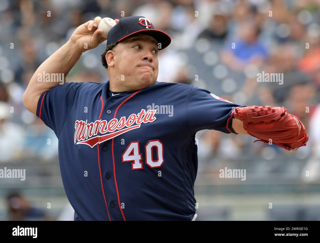 Minnesota Twins pitcher Bartolo Colon delivers the ball to the New York ...