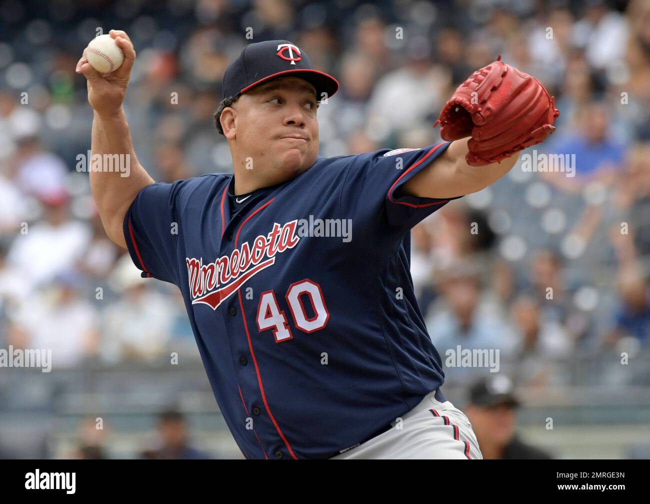 Minnesota Twins pitcher Bartolo Colon delivers the ball to the New York ...