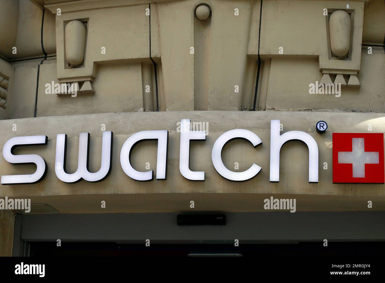 The logo of Swiss watchmaker "Swatch" is pictured on the Champs Elysees ...