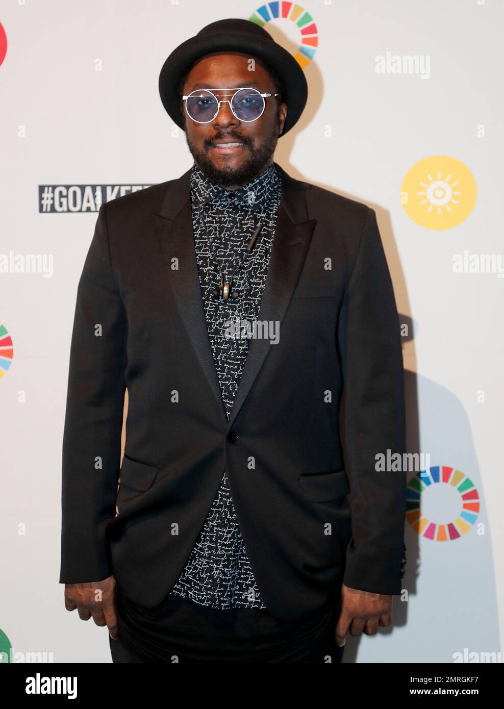 Will.i.am poses for photos before the Goalkeepers Global Awards dinner ...