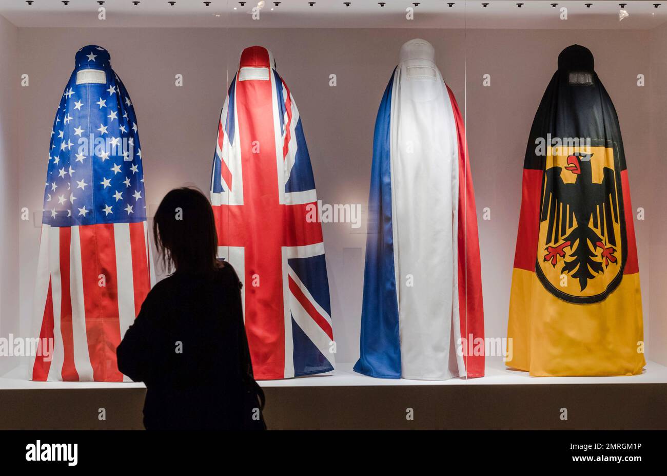 A Visitor walks by an installation by Haitian artist Jean Ulrick Desert ...
