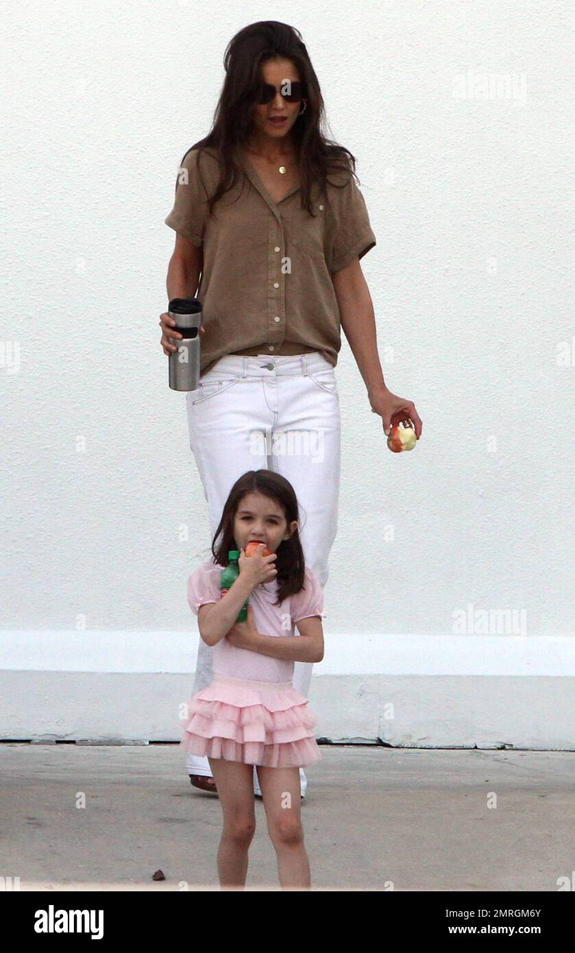 After spending some time together at the pool earlier in the day, Katie ...