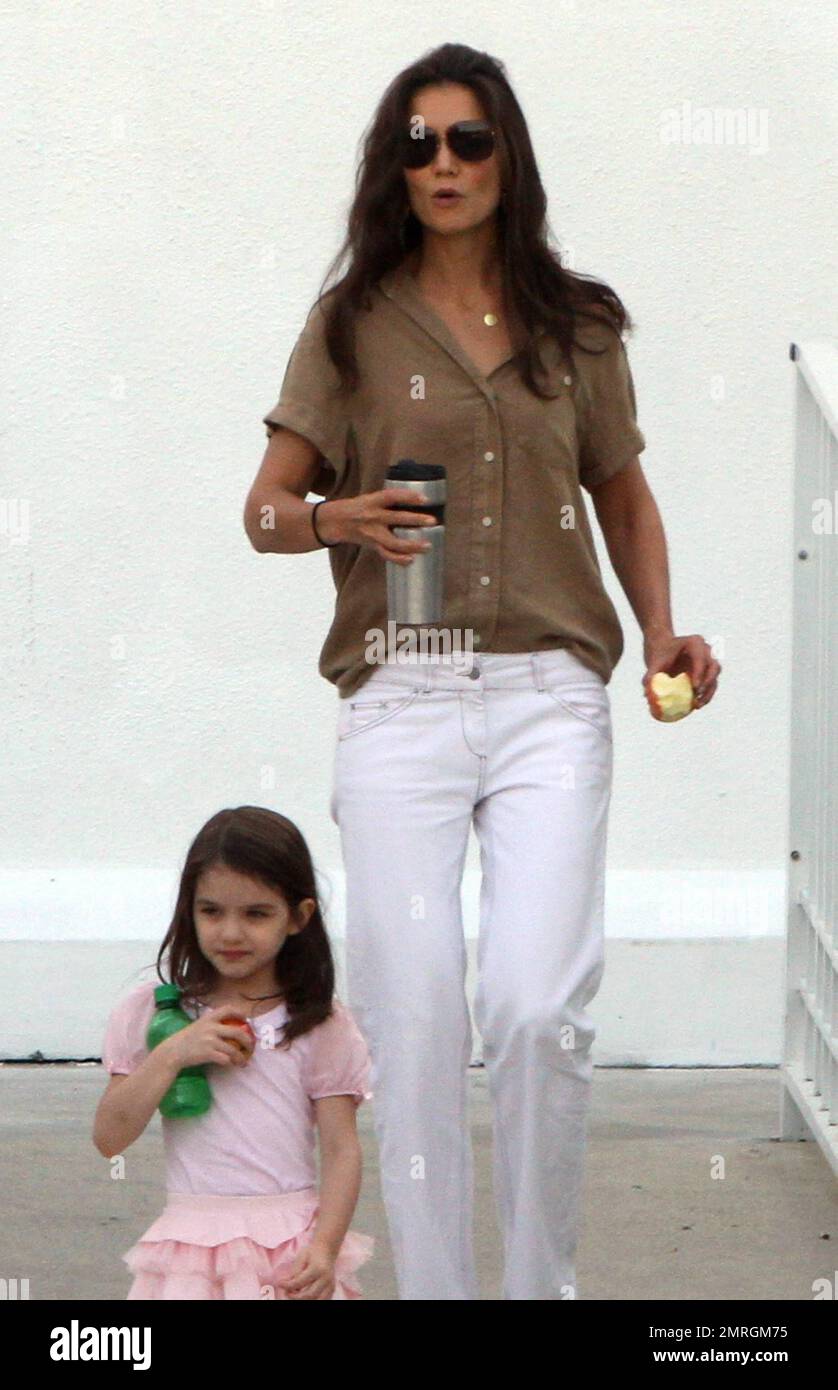 After spending some time together at the pool earlier in the day, Katie ...