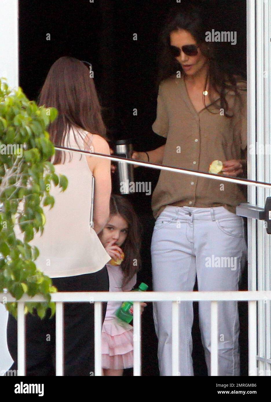 After spending some time together at the pool earlier in the day, Katie ...