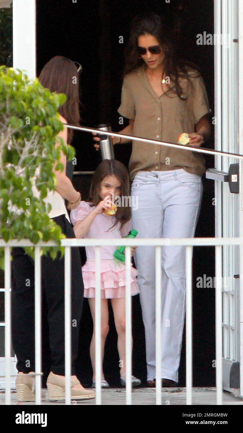 After spending some time together at the pool earlier in the day, Katie ...