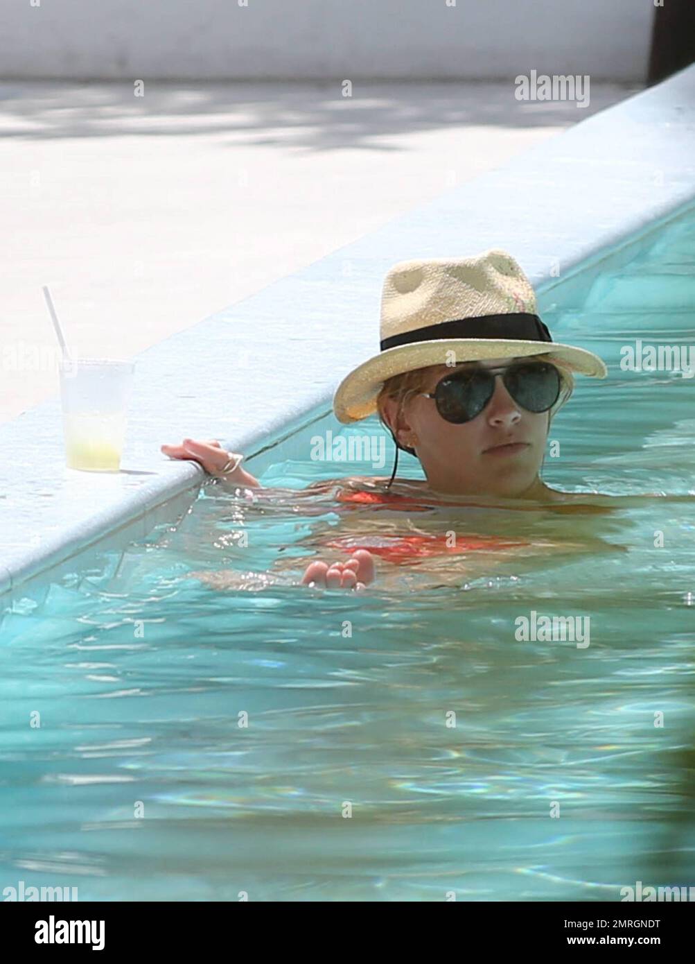 Katie Cassidy shows off her amazing figure in a red bikini as she ...