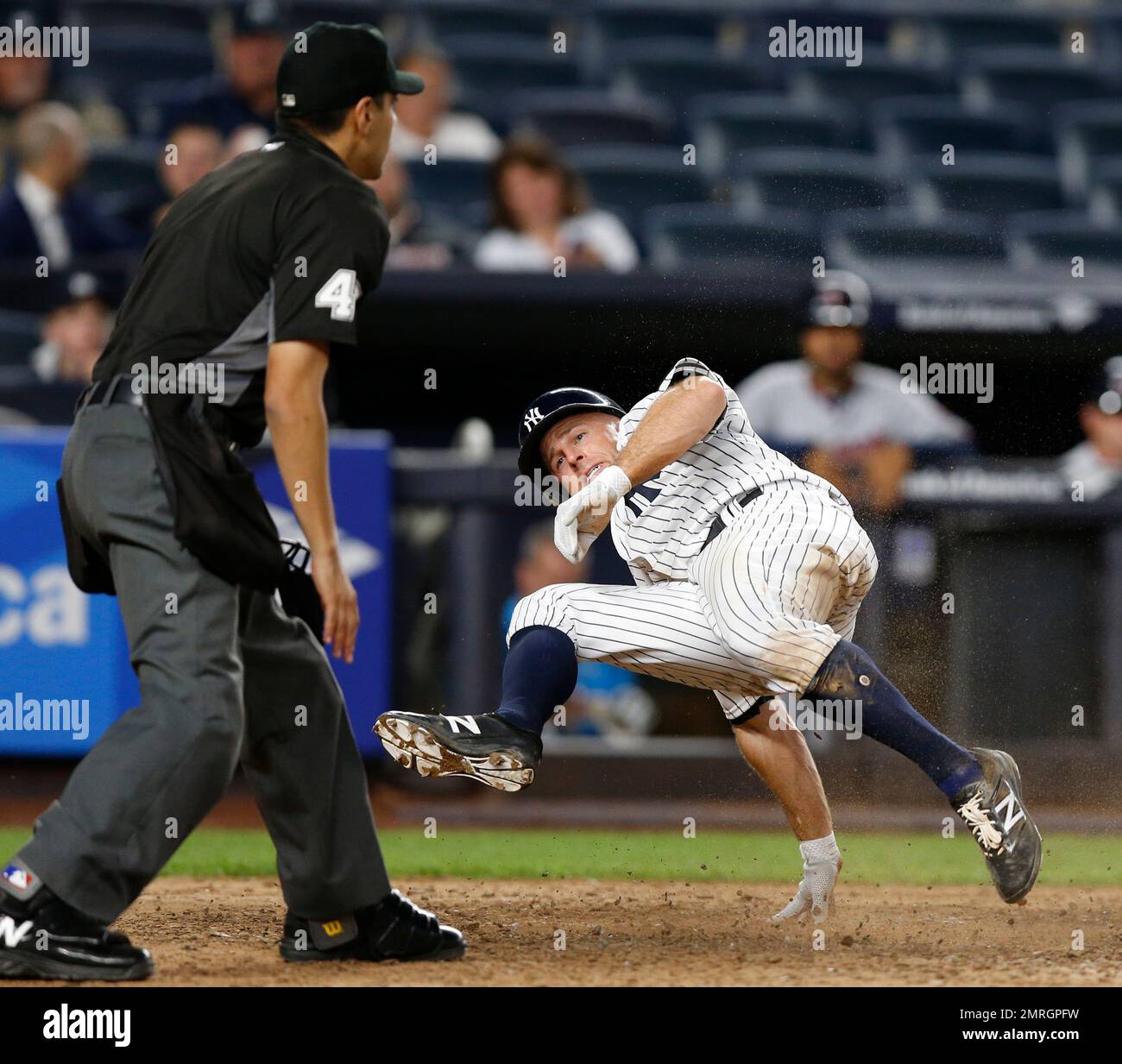 Home plate umpire Chad Fairchild (4) watches as New York Yankees' Brett ...